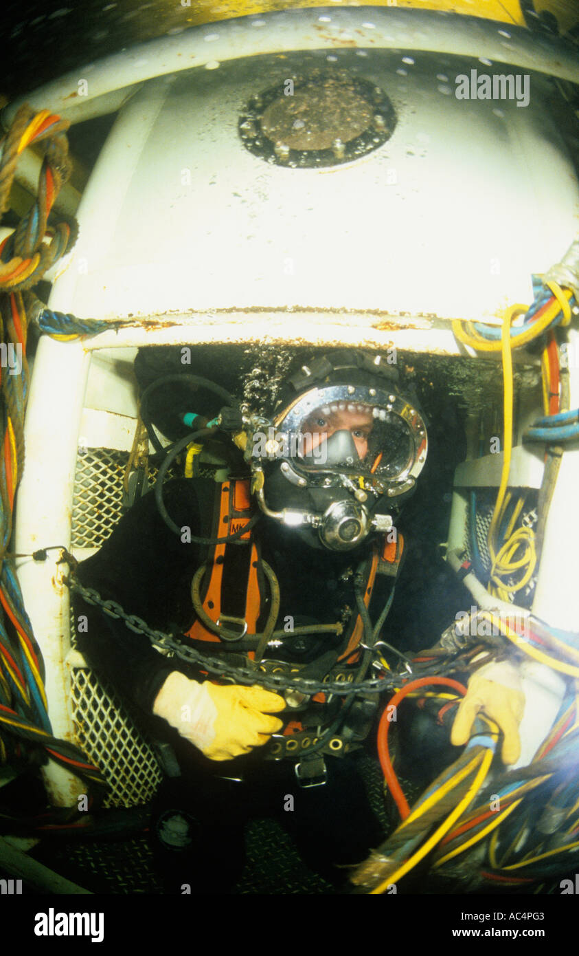 Commercial diver in training kneeling inside the wet bell Stock Photo ...