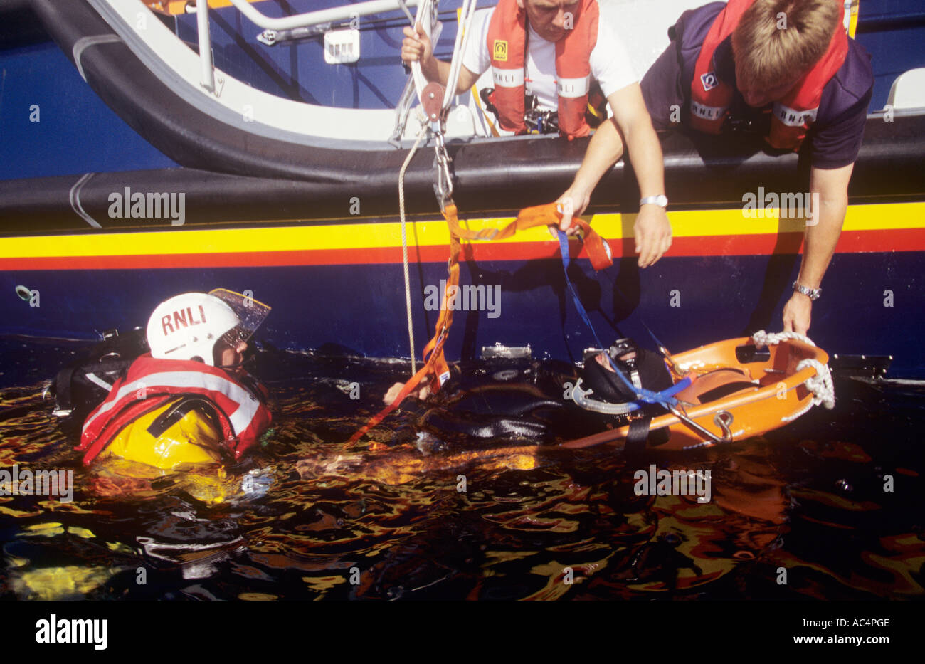 Members of RNLI Falmouth Inshore lifeboat crew practise recovery of ...