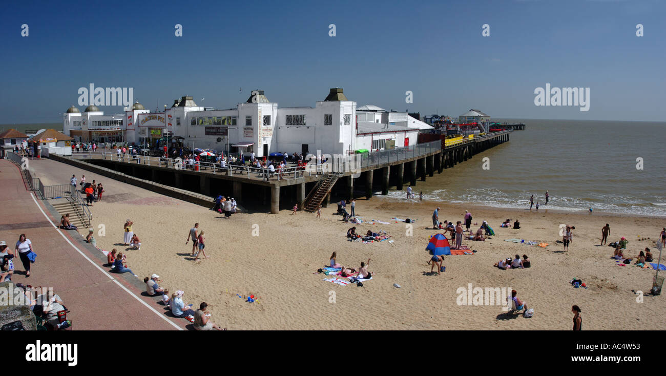 the scene at Clacton beach showing the Pier in the background Stock ...