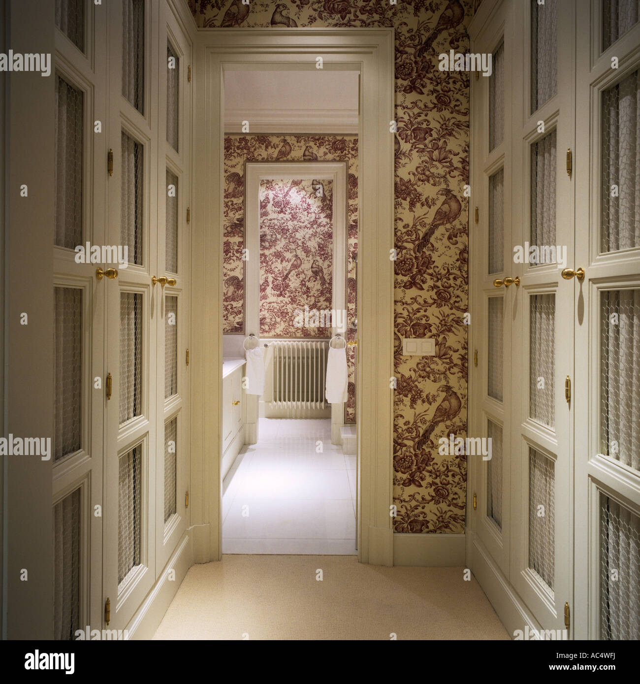 View through doorway down wallpaper panelled hallway Stock Photo - Alamy
