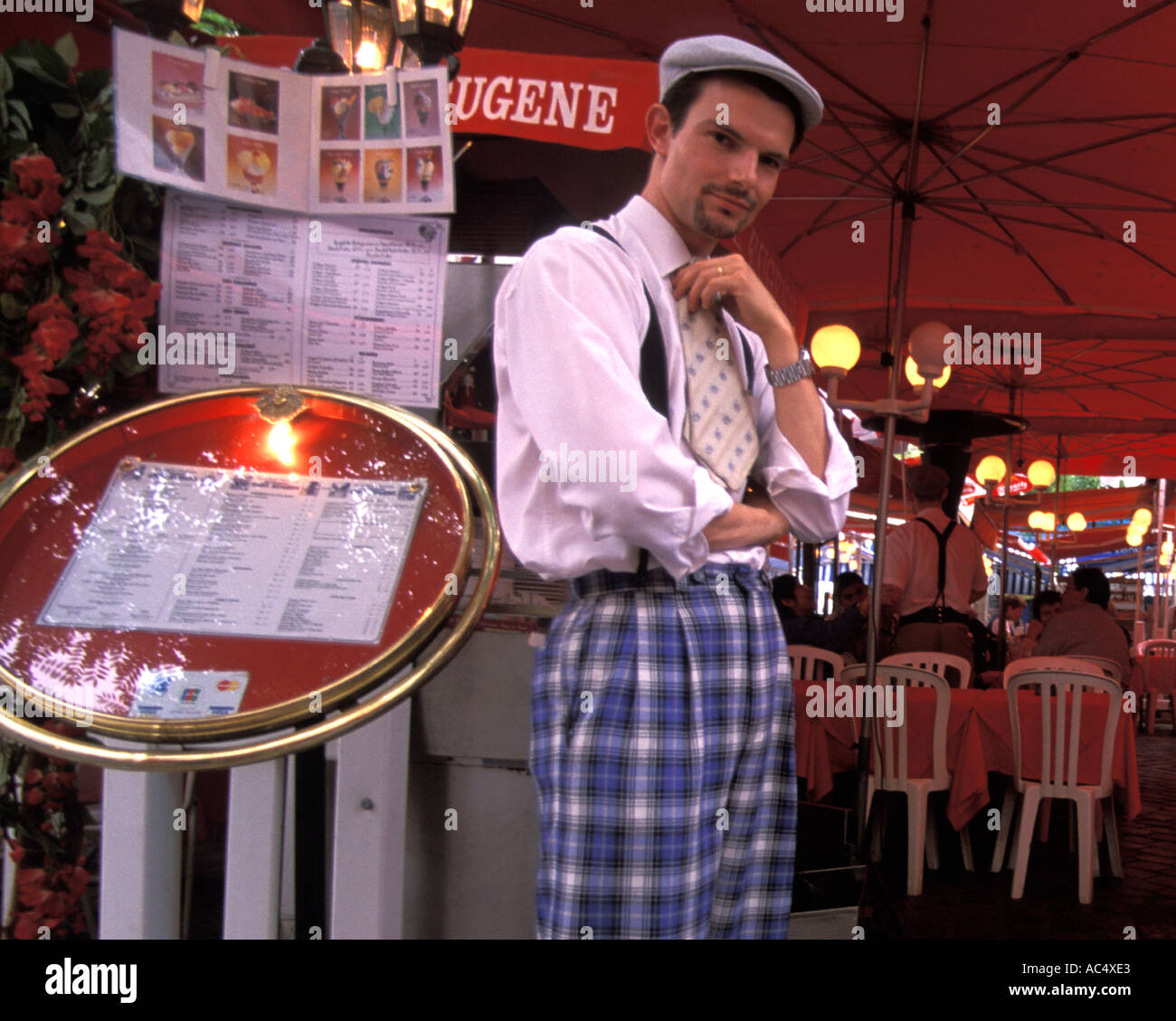 waiter at entrance to cafe restaurant cafe paris france Stock Photo - Alamy