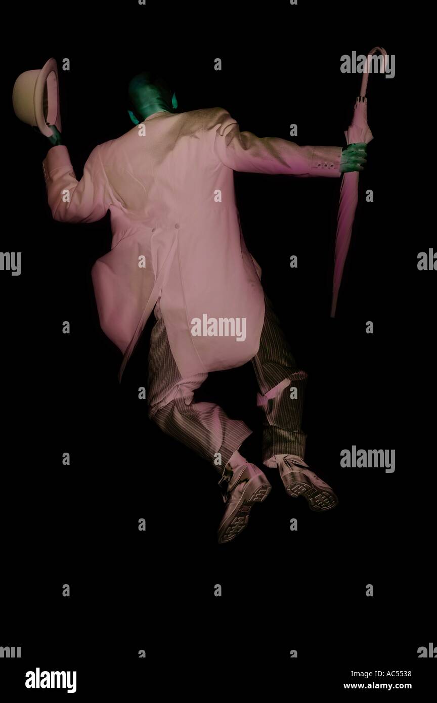 back dancing hat jump man umbrella person people Stock Photo - Alamy