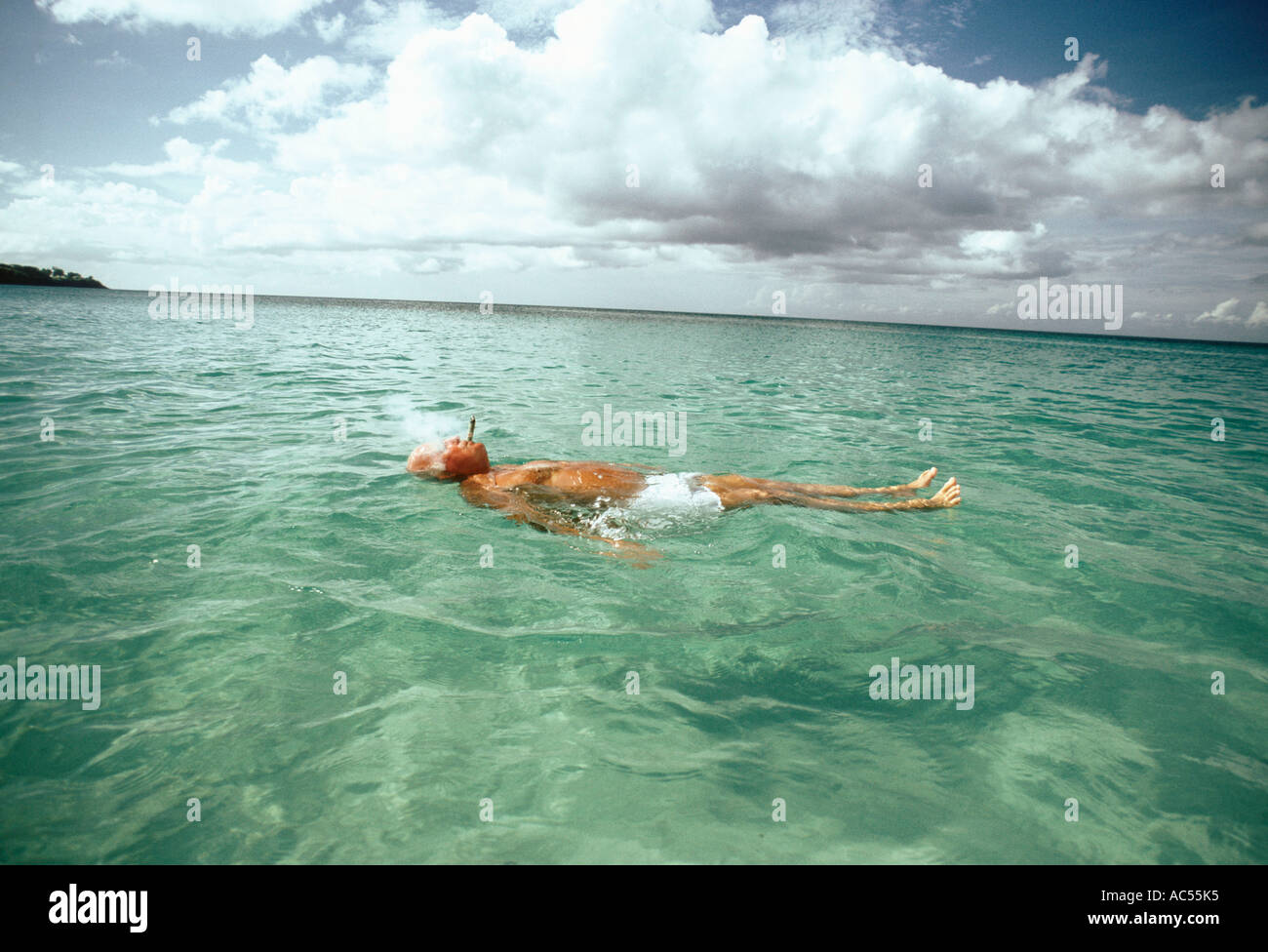 Man swimming and smoking a cigar hi-res stock photography and images ...