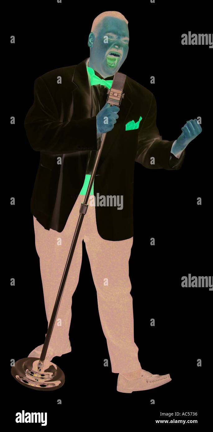 Man singing into microphone Cut Out Stock Images & Pictures - Alamy