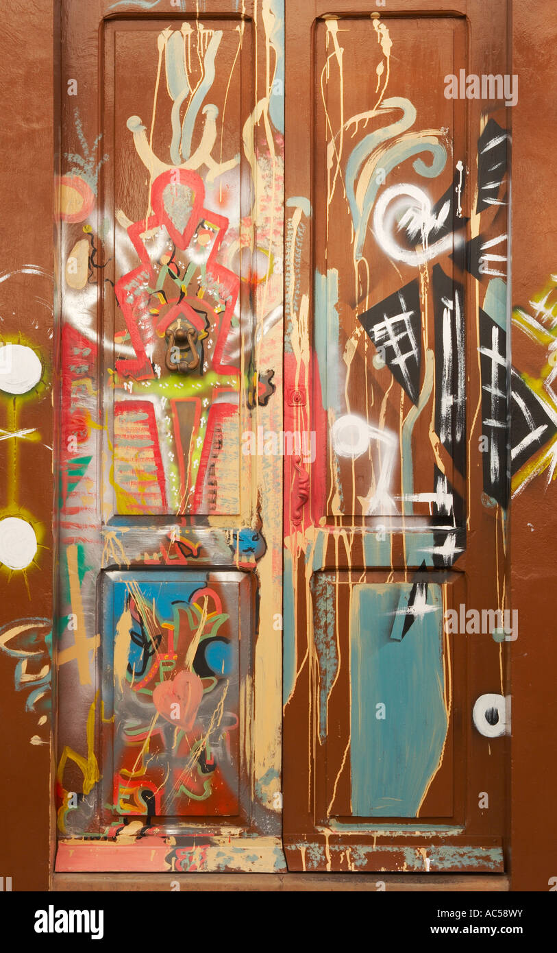 Graffiti on wooden door Stock Photo - Alamy