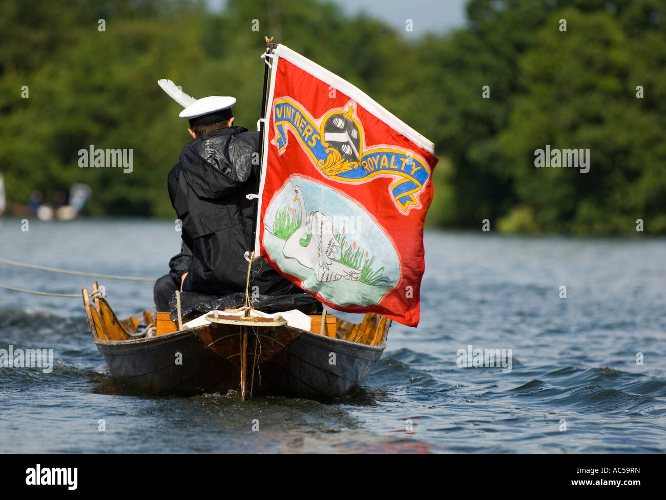 The Vintner's Company flag on a traditional Thames rowing skiff at the ...