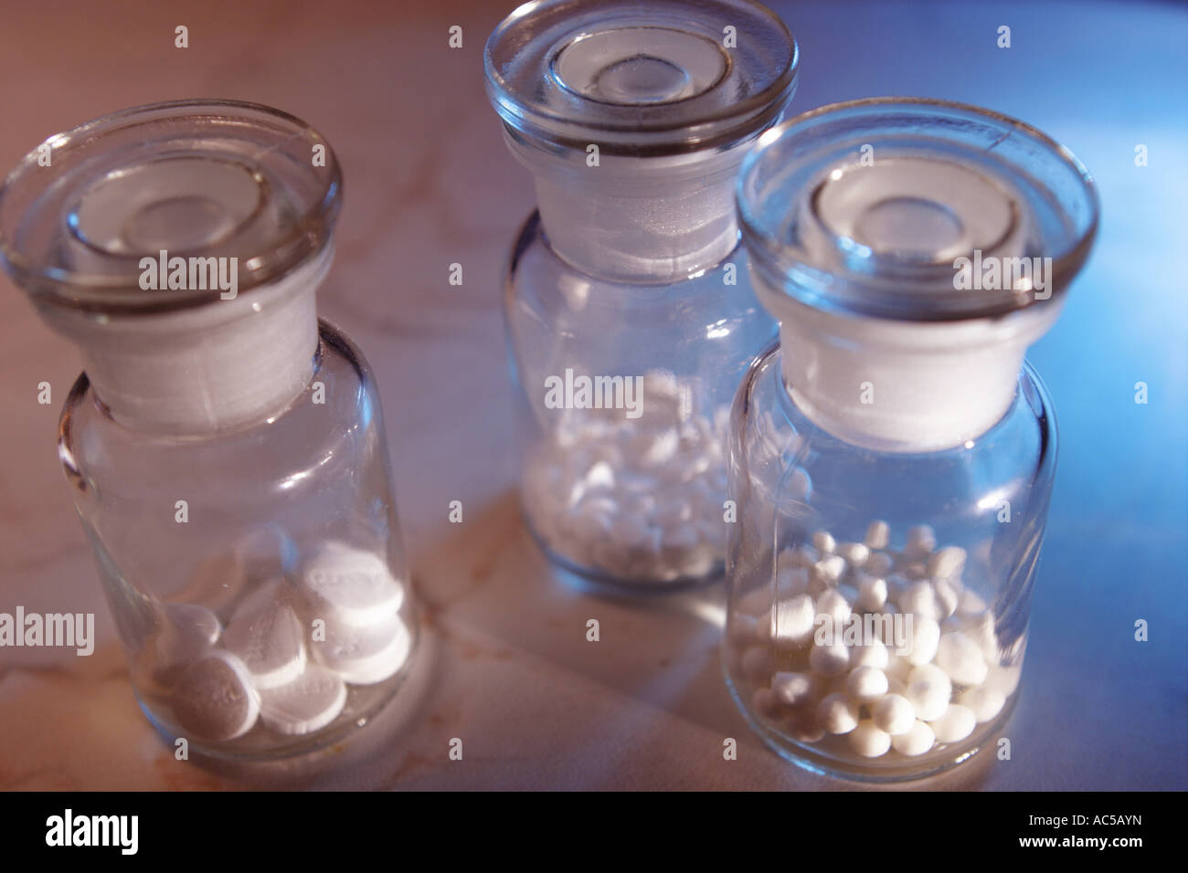 Homeopathic pills in glass bottles Stock Photo - Alamy