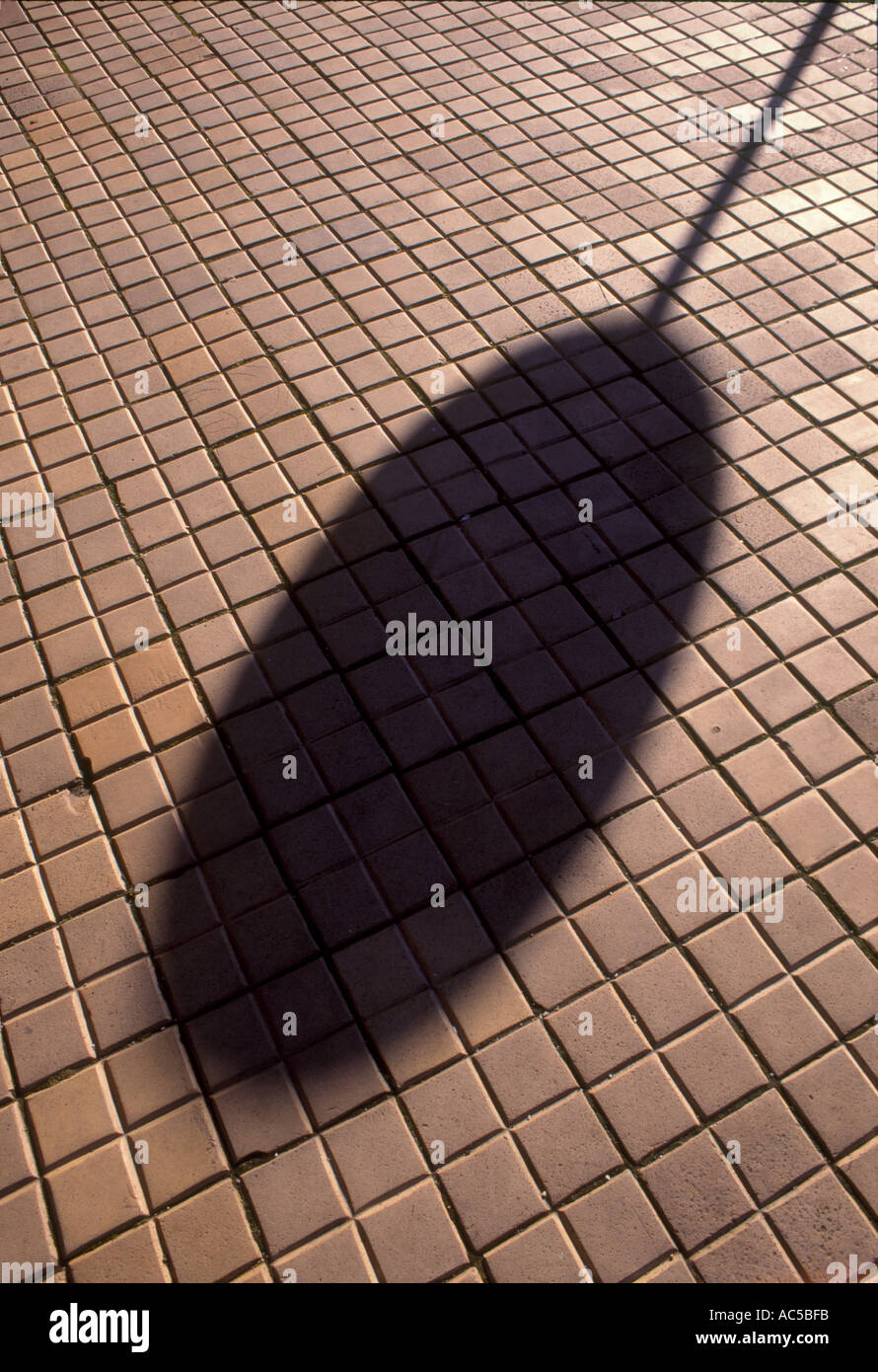 Shadow from a signpost Stock Photo - Alamy