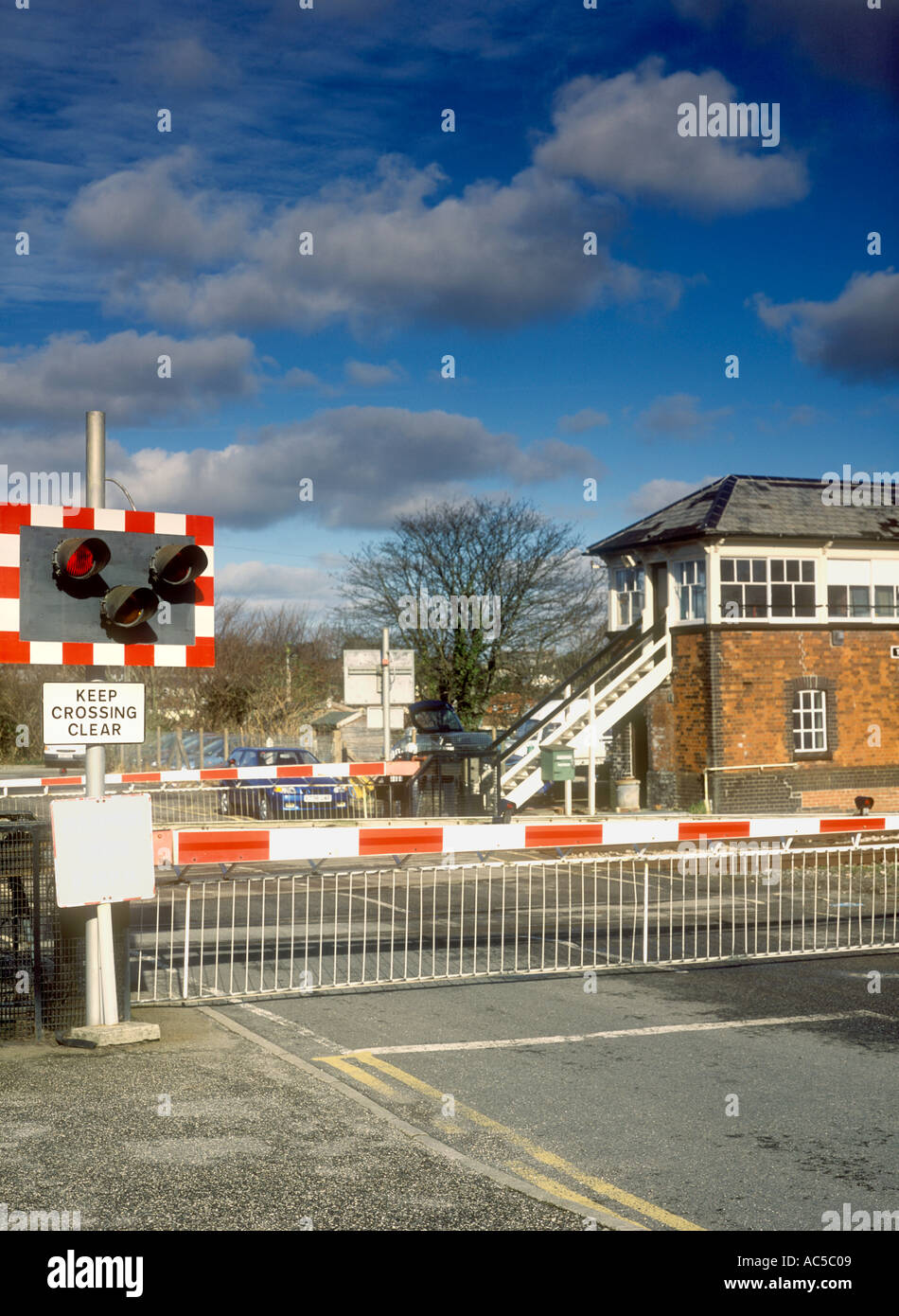 Level crossing in the UK with the barrier lowered Stock Photo - Alamy