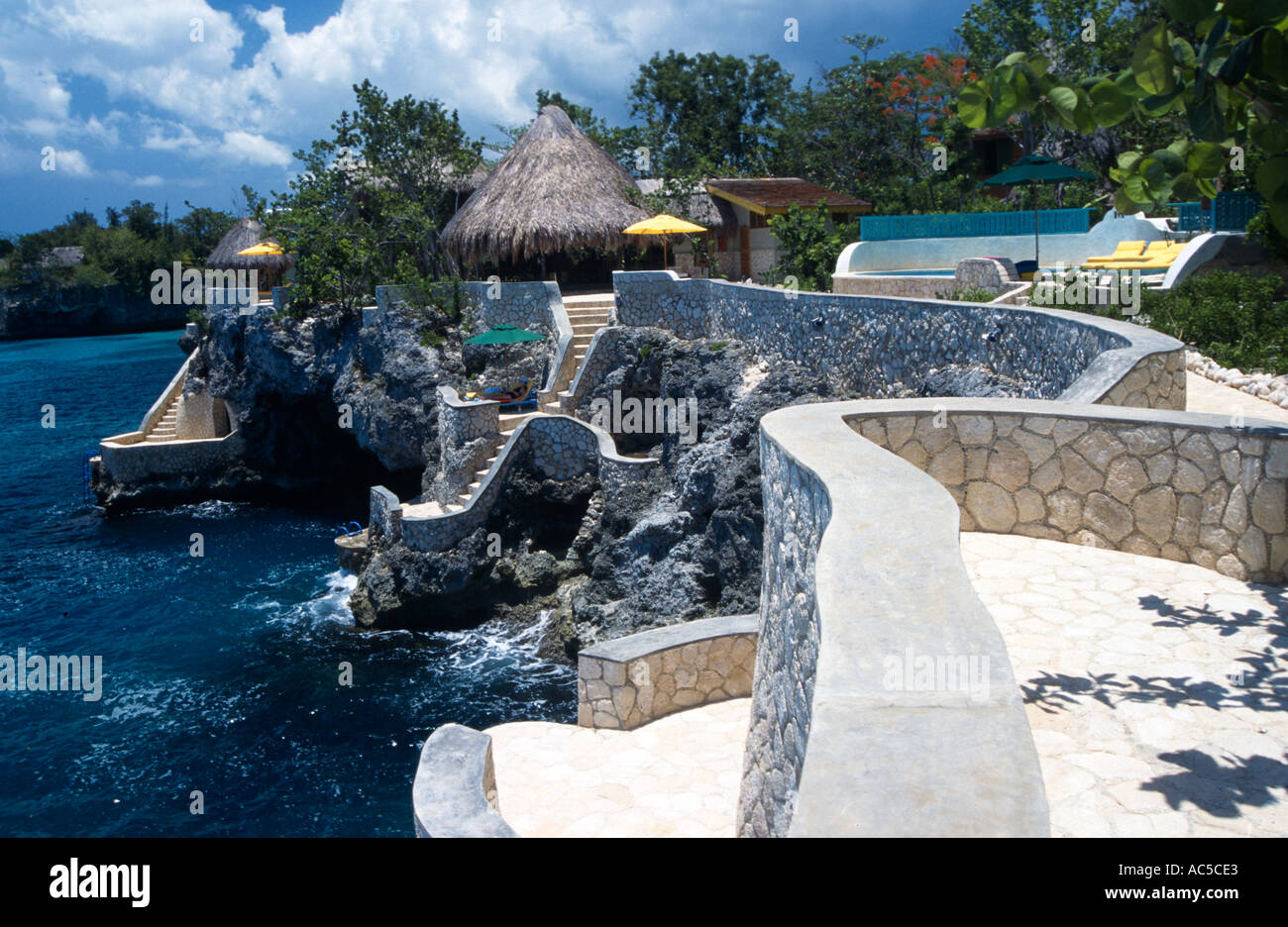 Ecotourism thatched roof huts on the edge of cliffs and the sea at The ...