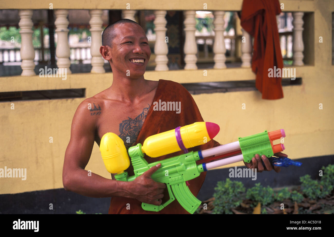 B uddhist monk with water gun during Pi mai festival Vientiane Laos ...