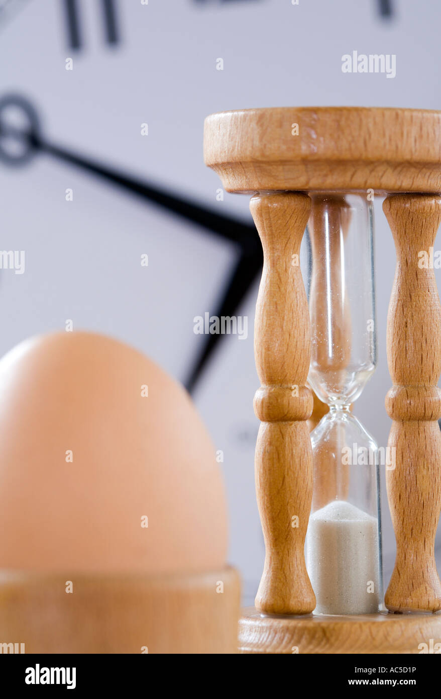 Egg timer with clock face time in background and egg in front Stock ...