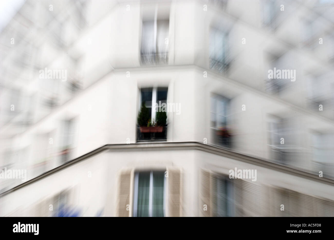 zooming in on window in building in Paris Stock Photo - Alamy