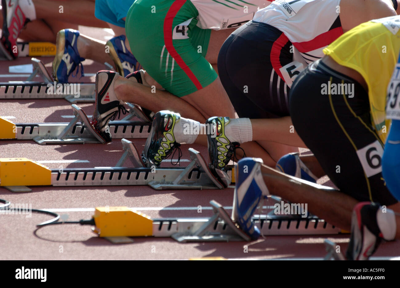 sprinters in the starting blocks at the start of a race Stock Photo - Alamy