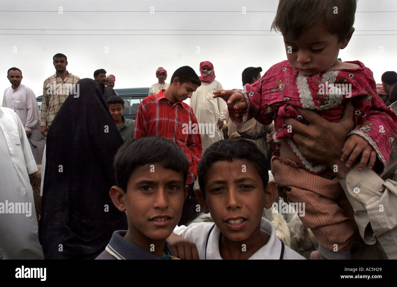 Iraq basra Life 2005 Boys lift a child over their heads at one of Basra ...