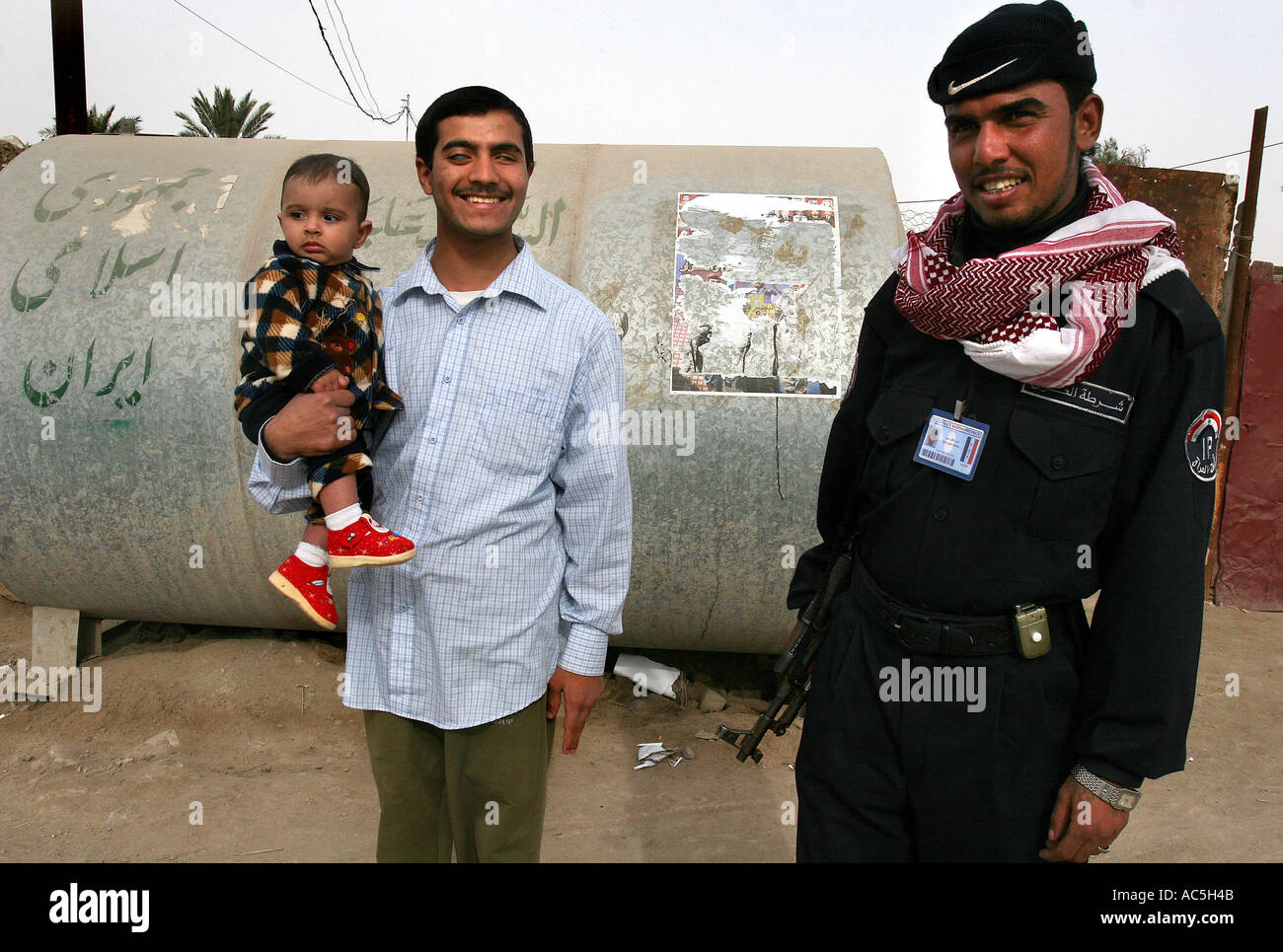 Iraq Basra Life in 2005 A blindman proudly displays his baby son as an ...