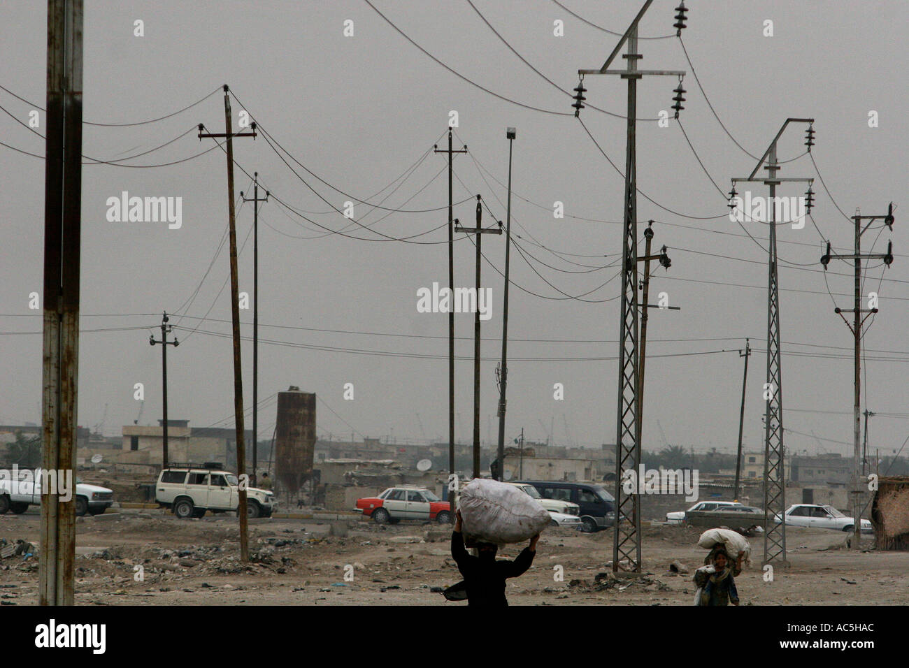 Iraq basra Life 2005 Young girls struggle under the weight of big bags ...