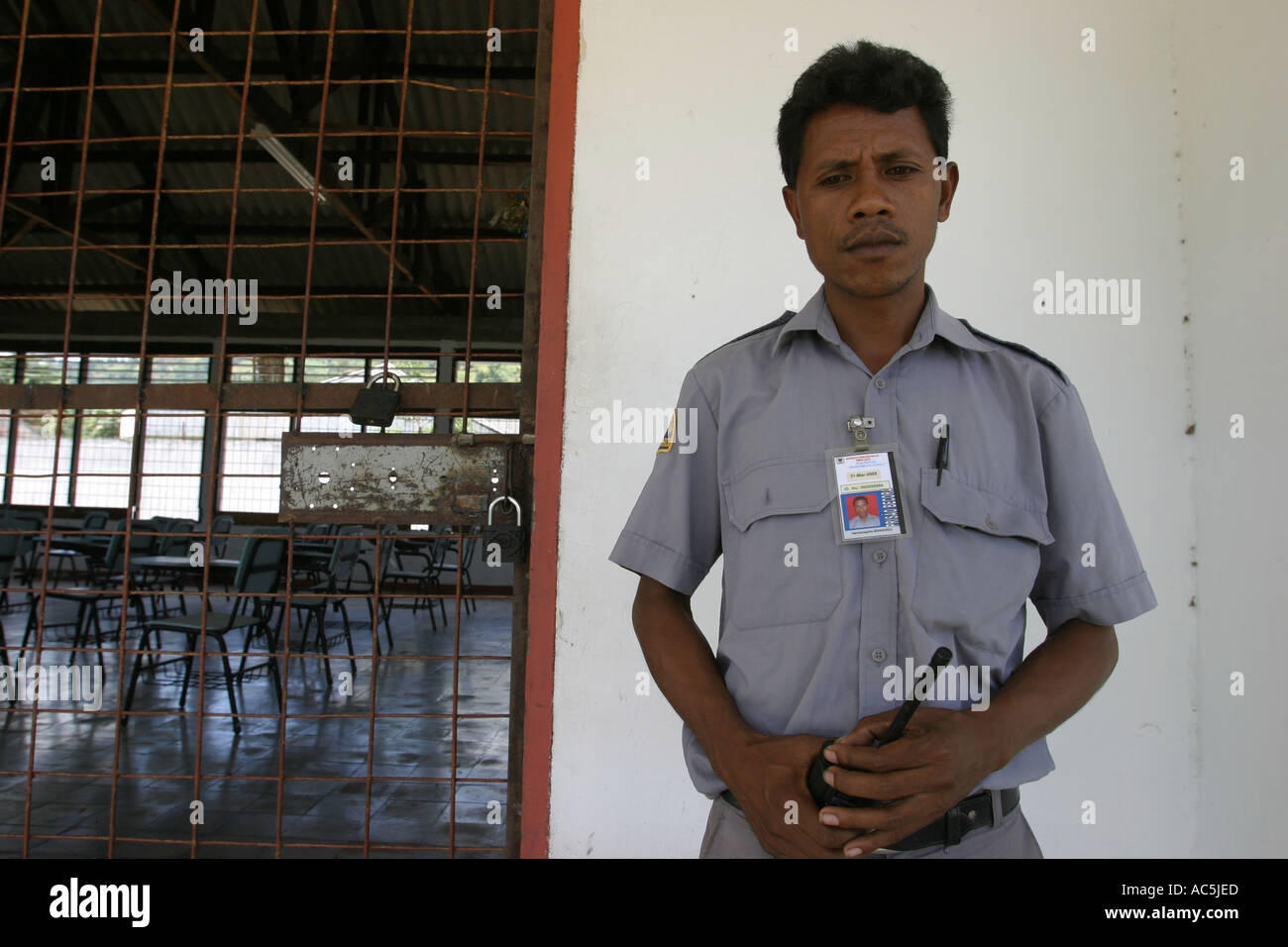 A prison guard stands with downcast eyes at Dili s Bekora prison Stock ...
