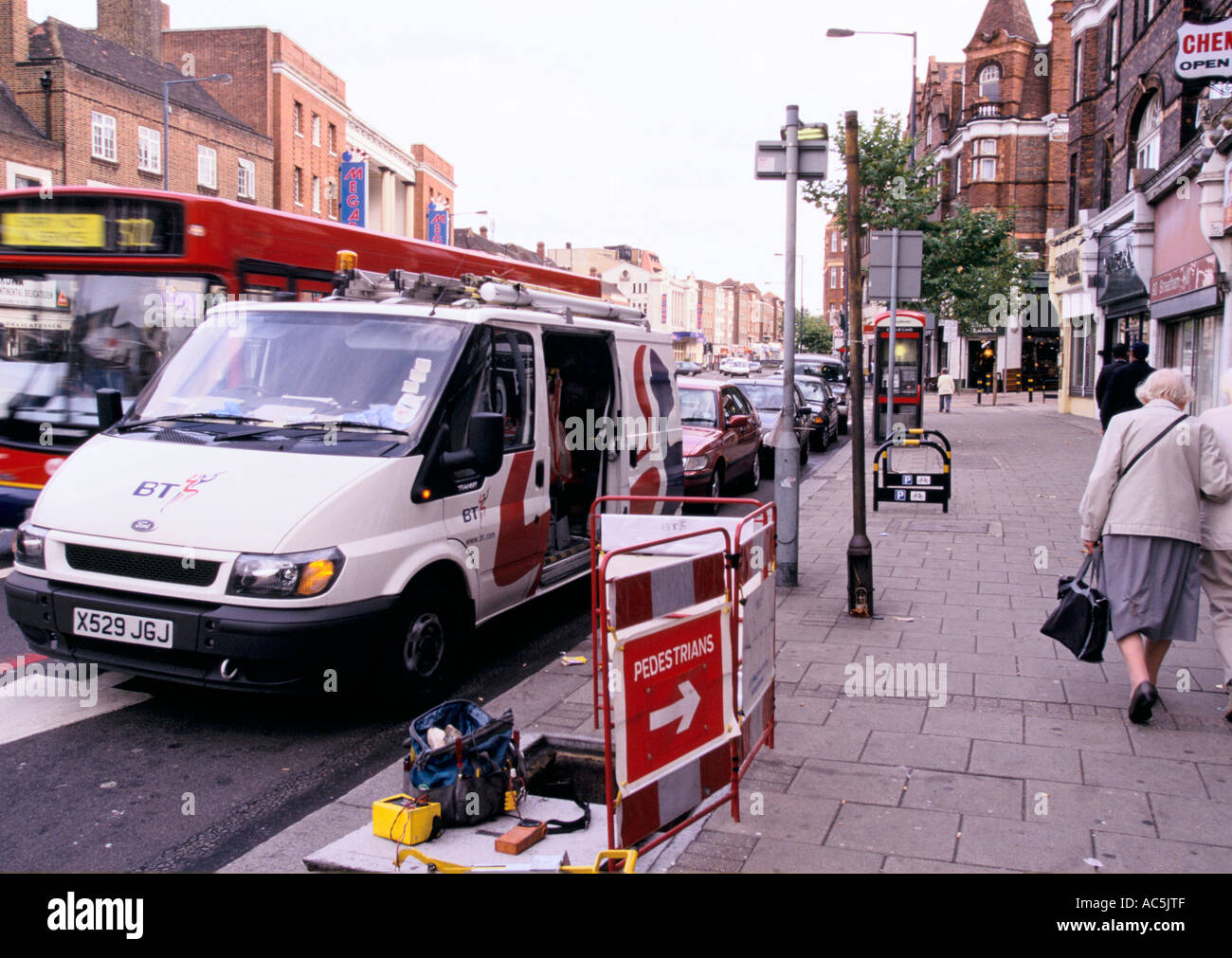 Bt public phone booth with advertising hi-res stock photography and ...