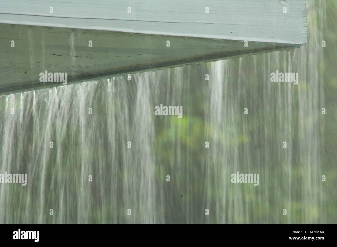Rain pouring off roof of house hi-res stock photography and images - Alamy