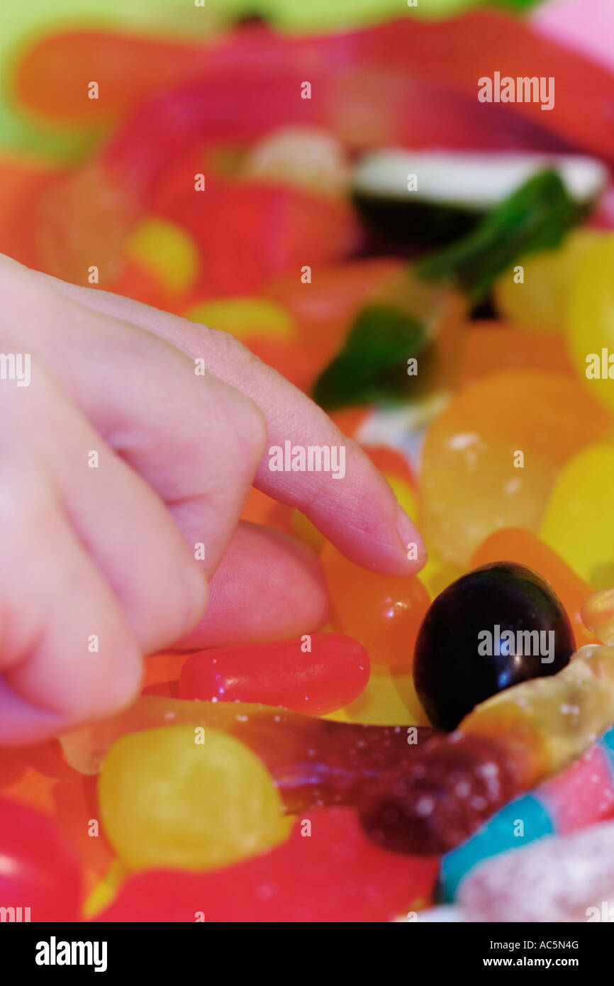 child's hand picking candies Stock Photo - Alamy