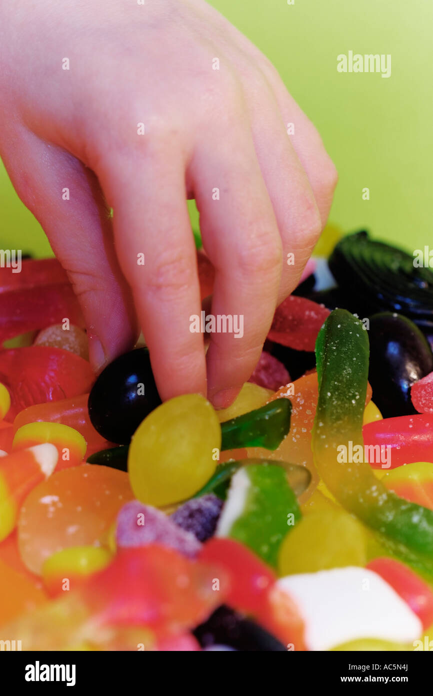 child's hand picking candies Stock Photo - Alamy