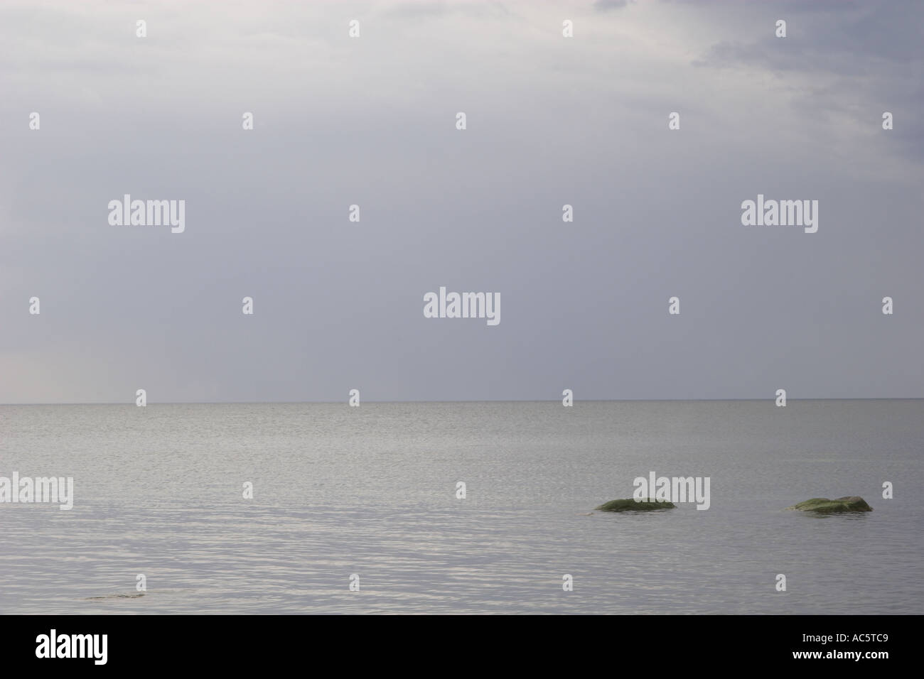 View of calm water during storm Stock Photo - Alamy