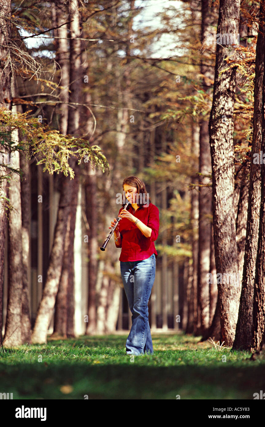 Young woman playing flute hi-res stock photography and images - Alamy