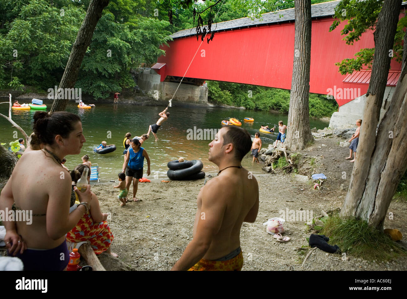 People swimming partying at Shushan covered bridge Jackson New York ...