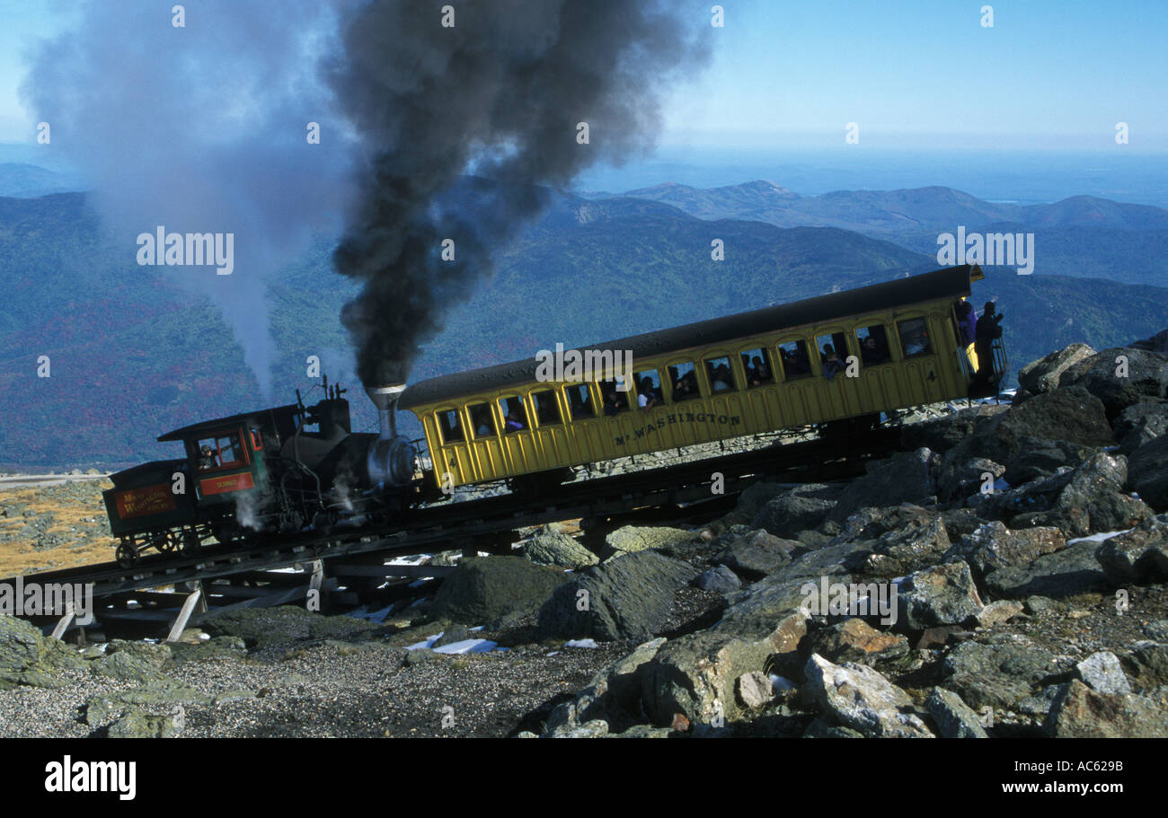 Cog Railway steam engine and carriage travelling on the Mount ...