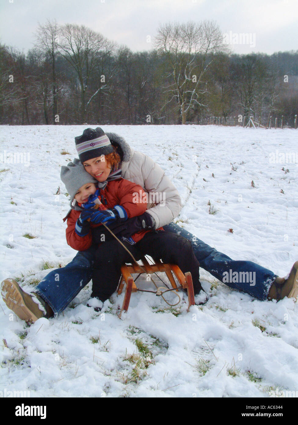 Kids pulling and pushing sled hi-res stock photography and images - Alamy