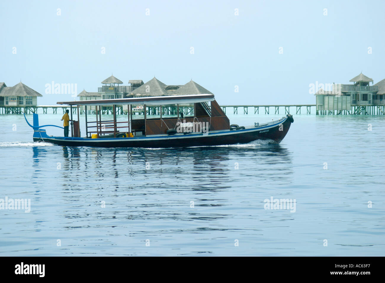 Local Dhoni boat passing Soneva Ghili resort Maldives Stock Photo - Alamy
