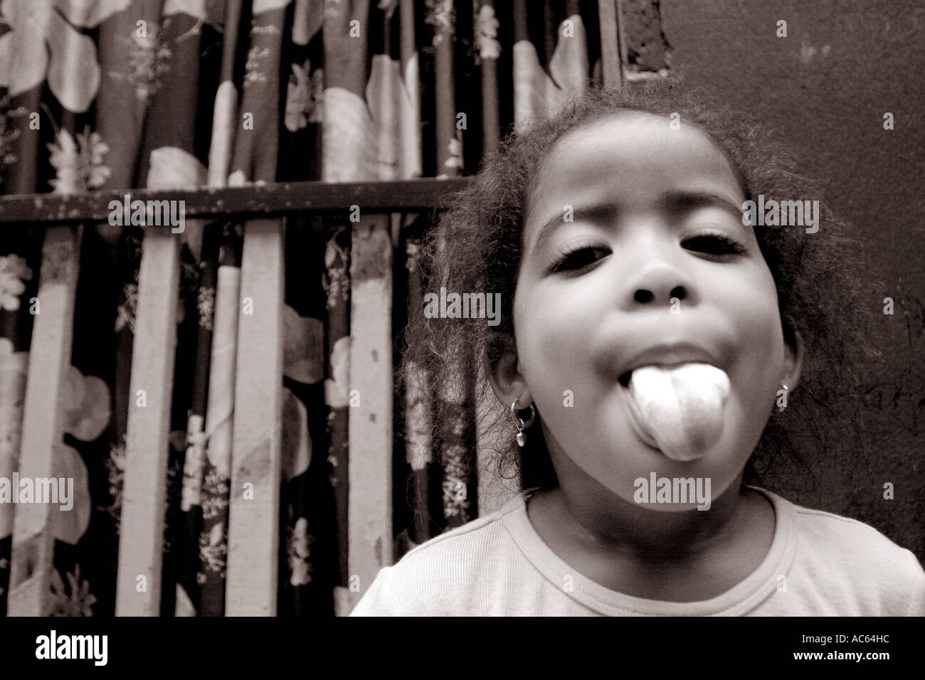 A Young Panamenian Girl Showing Her Tongue Making Fun Of The Viewer A
