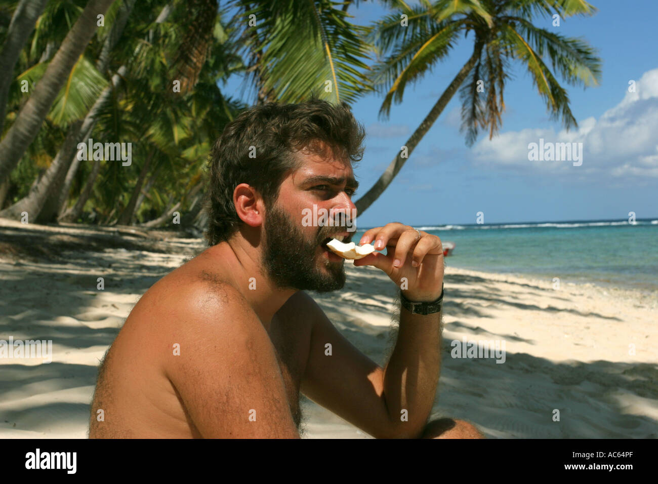 Man eating coconut beach hi-res stock photography and images - Alamy