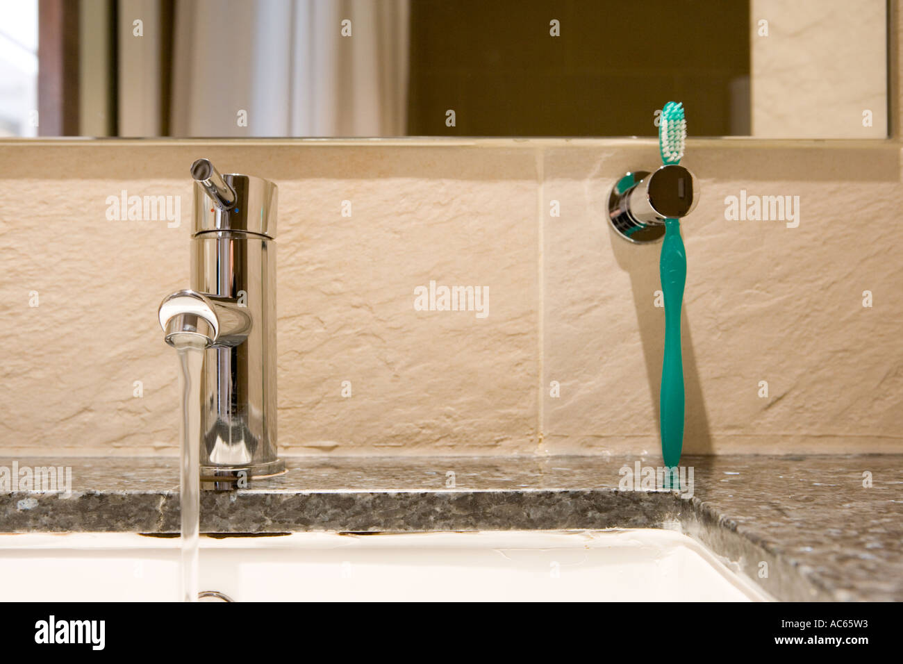 toothbrush and tap Stock Photo - Alamy
