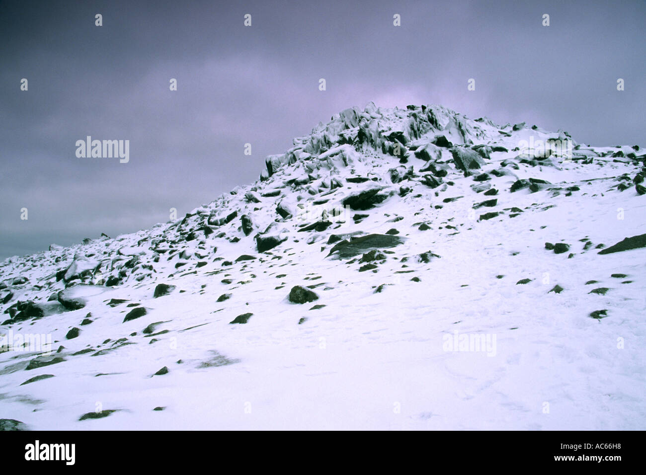 View of Bowfell summit at 902 meters above sea level covered in winter ...