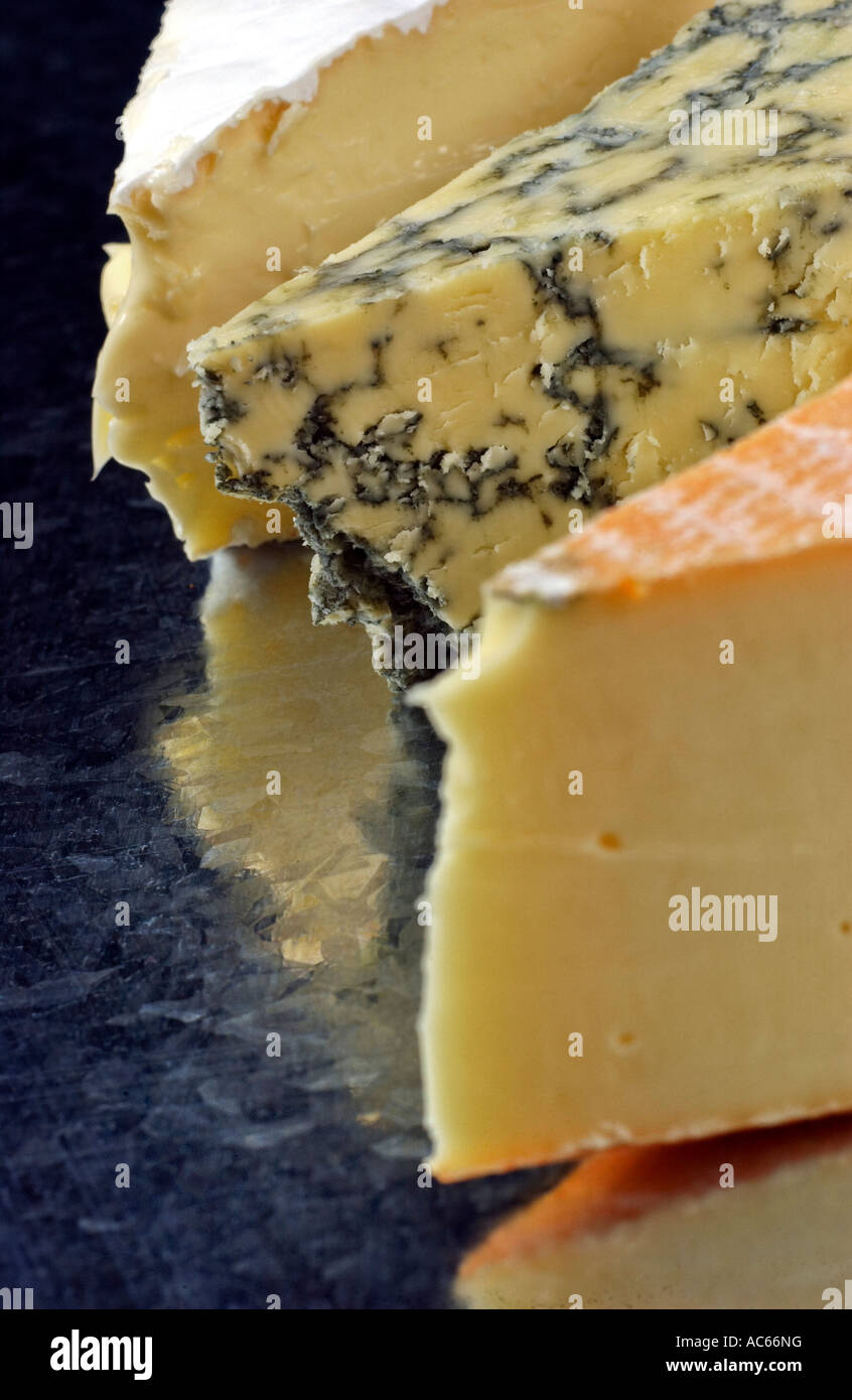 Wedges of Brie Stilton and Port Salut cheese Stock Photo - Alamy