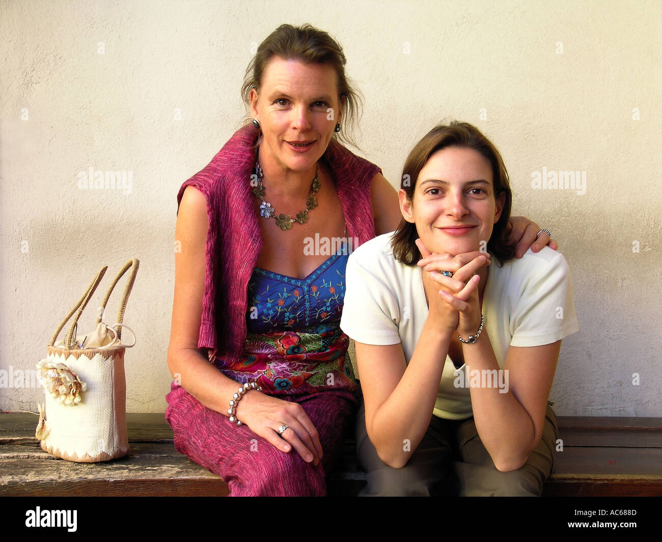 Mother and daughter on bench France Stock Photo - Alamy