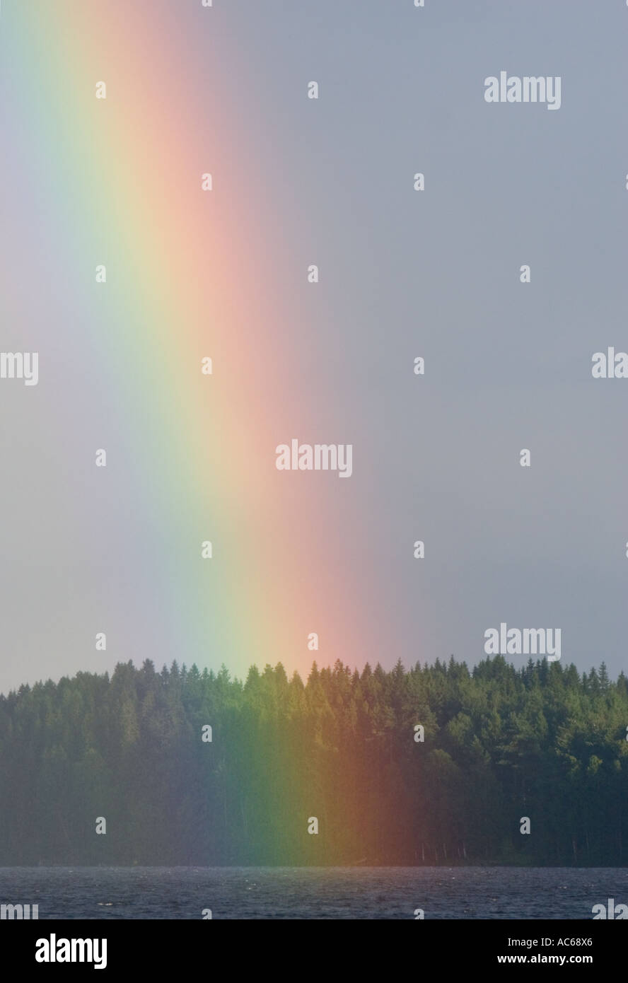 The end of the rainbow ending to a lake , Finland Stock Photo - Alamy