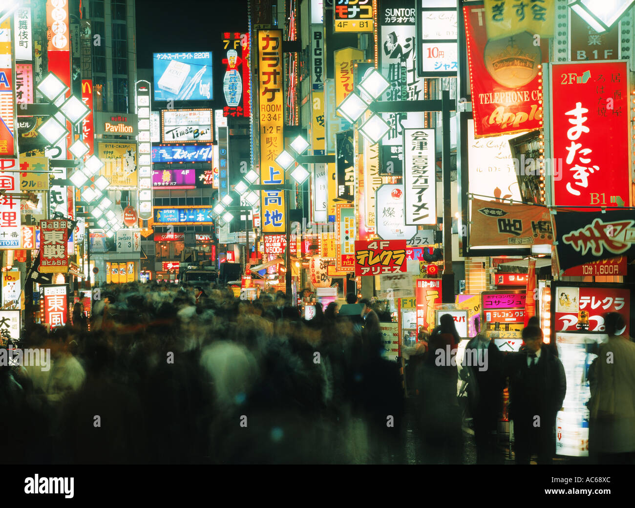 Busy walking street in Ginza district at night in Tokyo Stock Photo - Alamy