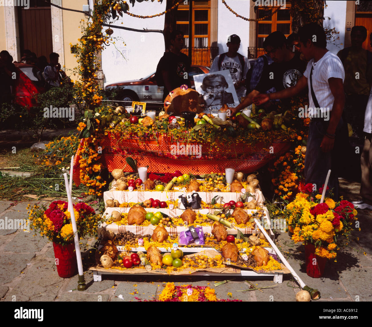 Altar prepared with flowers, food, and gifts for the Day of the Dead ...