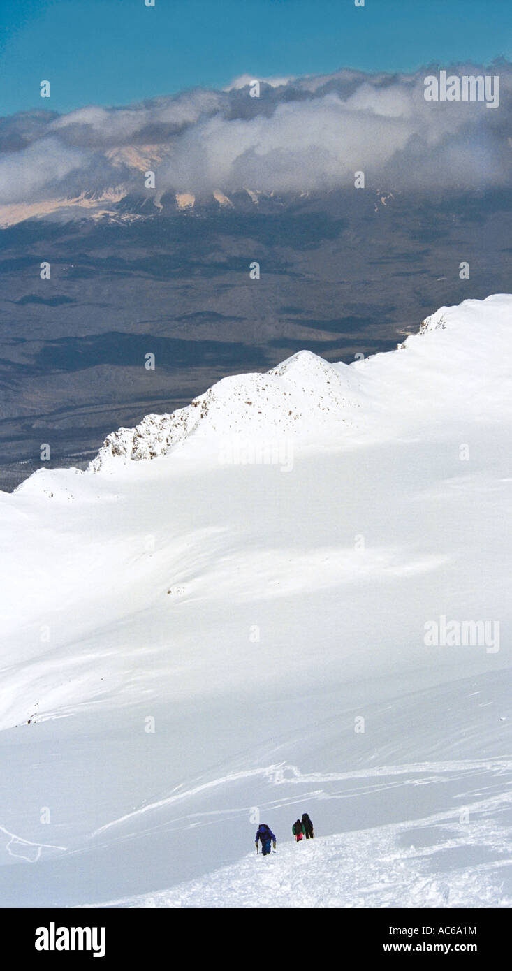 Two alpinists are walking down the Kupol Mountain. The Aktru Gorge ...