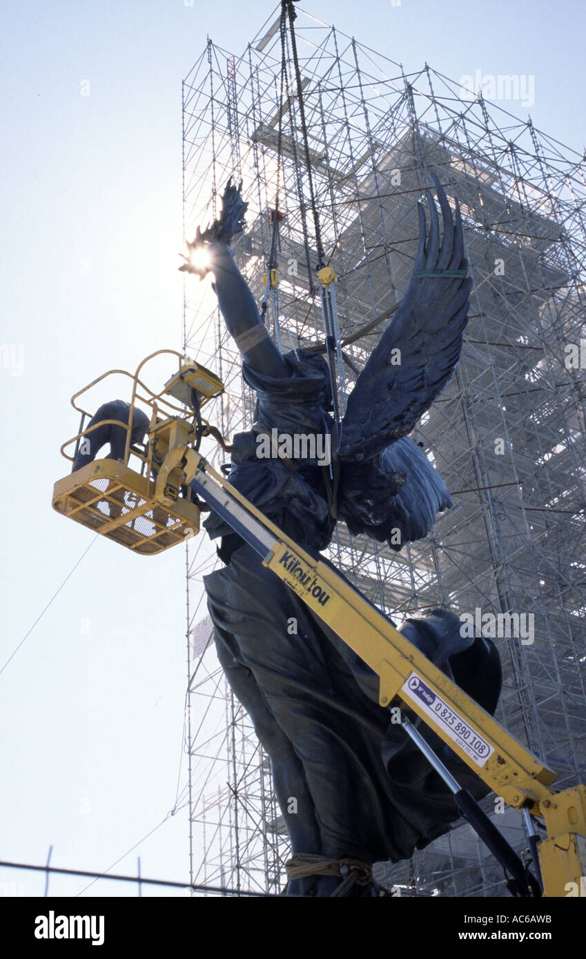 skilled workman moving colossal huge statue Stock Photo - Alamy