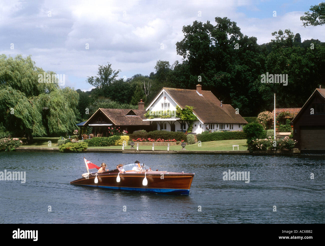 A traditional slipper launch near Hambleden Lock on the River Thames ...