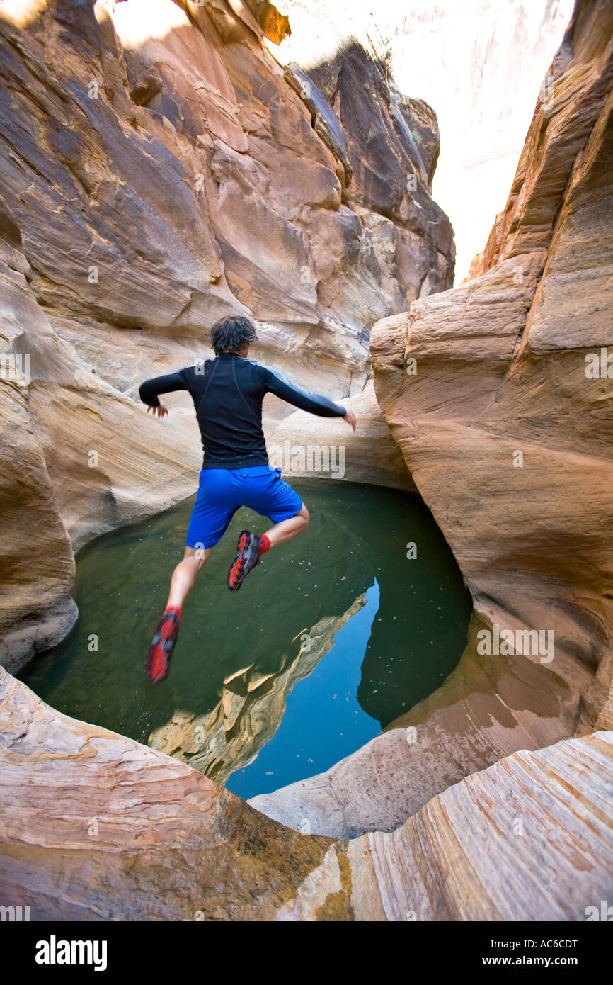 Mark Howe jumping into a pool in Eardley Canyon San Rafael Swell Utah ...