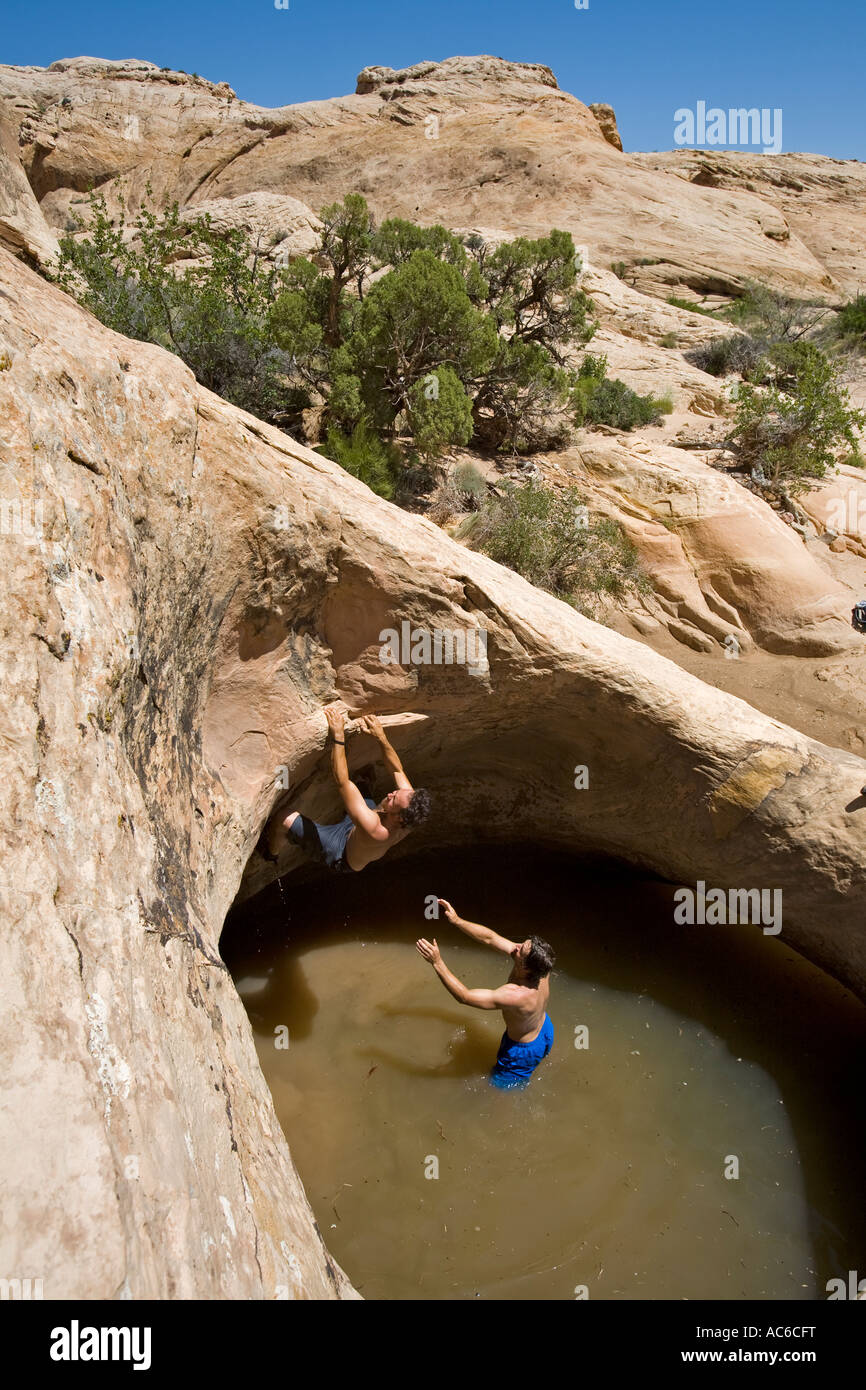 Eric Odenthal bouldering in a desert pool while Mark Howe spots in Zero ...