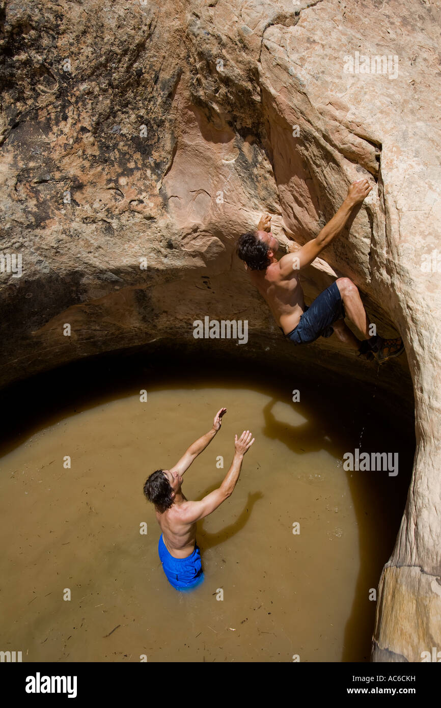 Eric Odenthal bouldering in a desert pool while Mark Howe spots in Zero ...