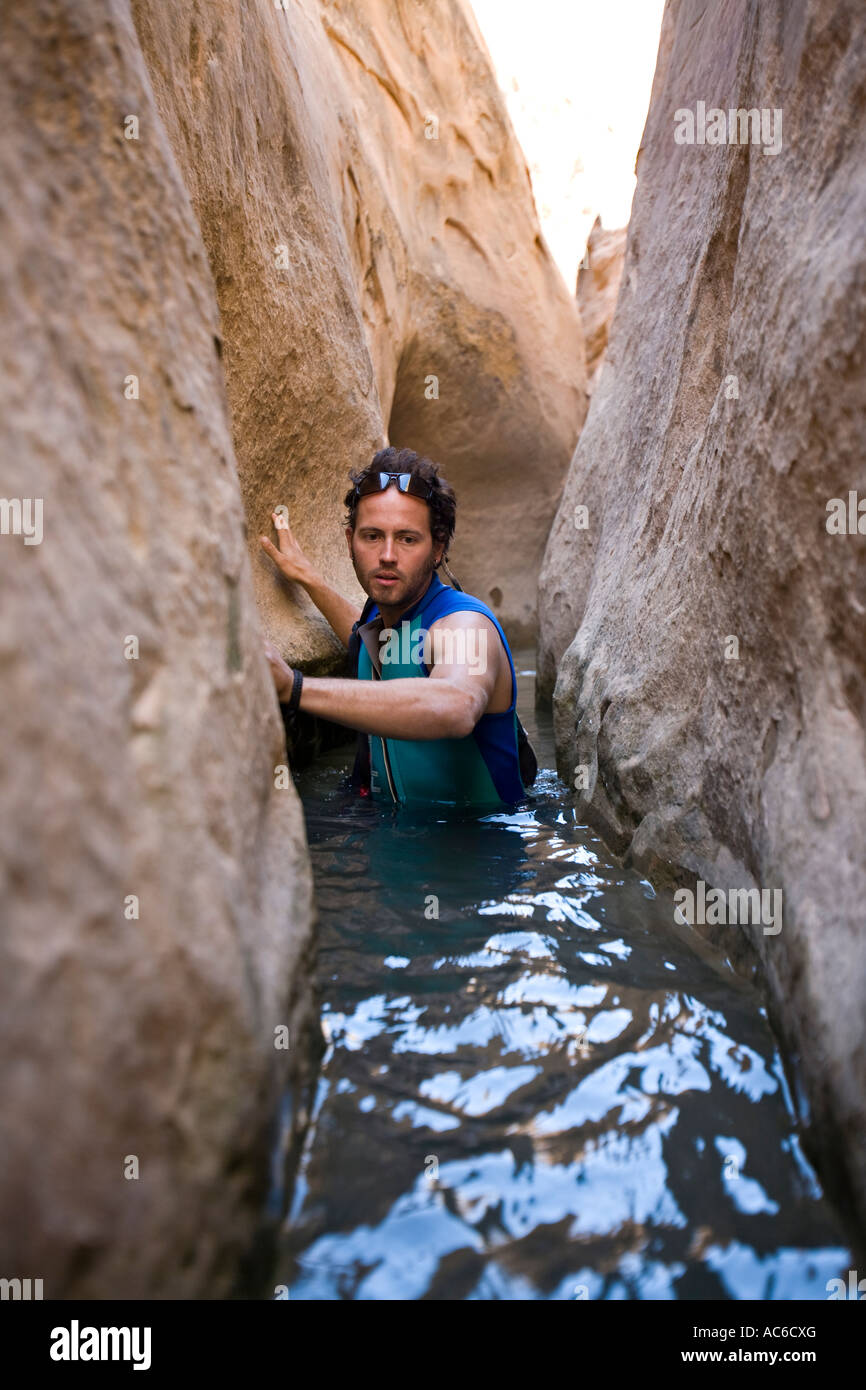 Eric Odenthal wading through a narrow slot canyon called Zero Gravity ...