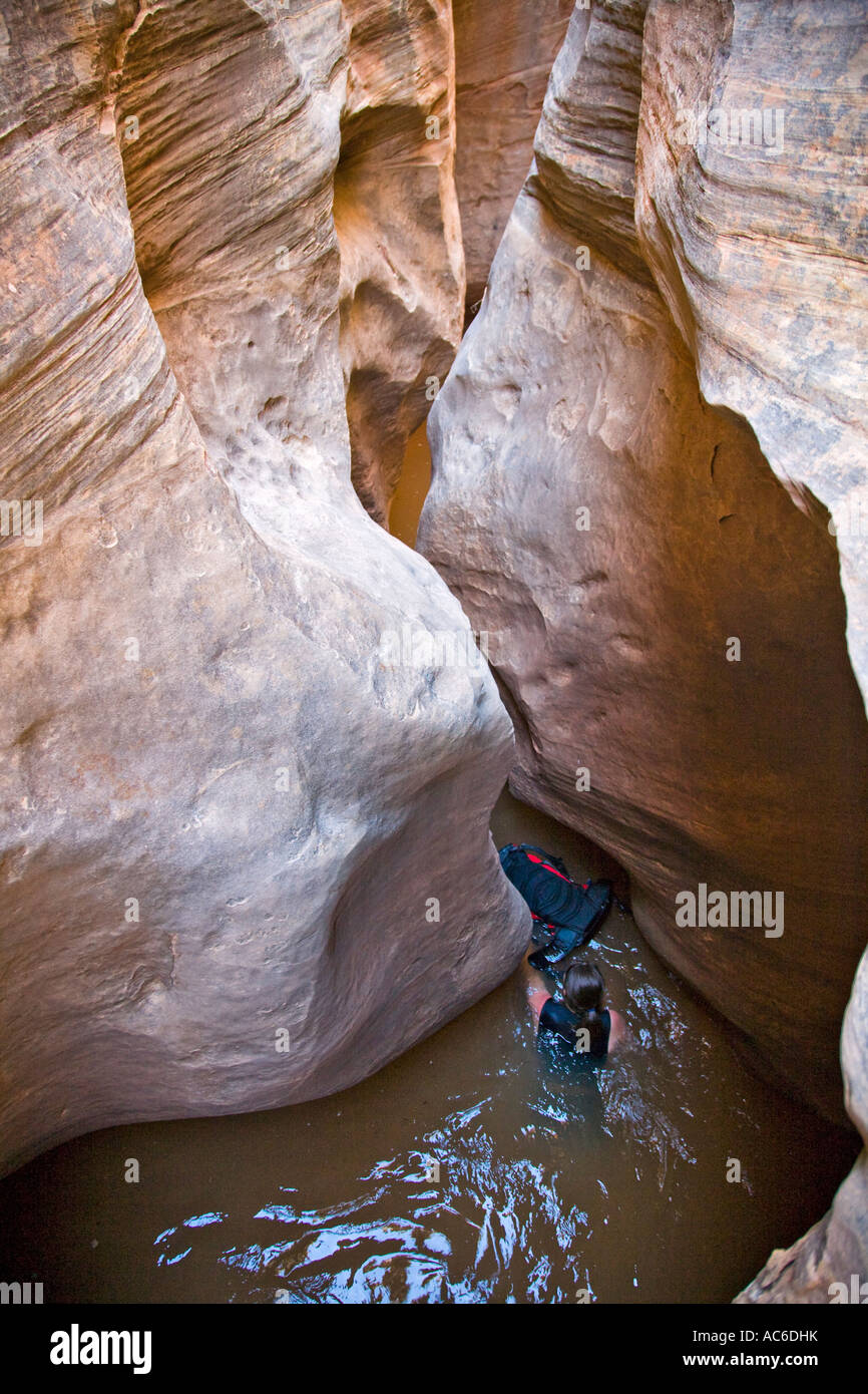 Anne Bogan swimming through pool while canyoneering in Cheesebox Canyon ...