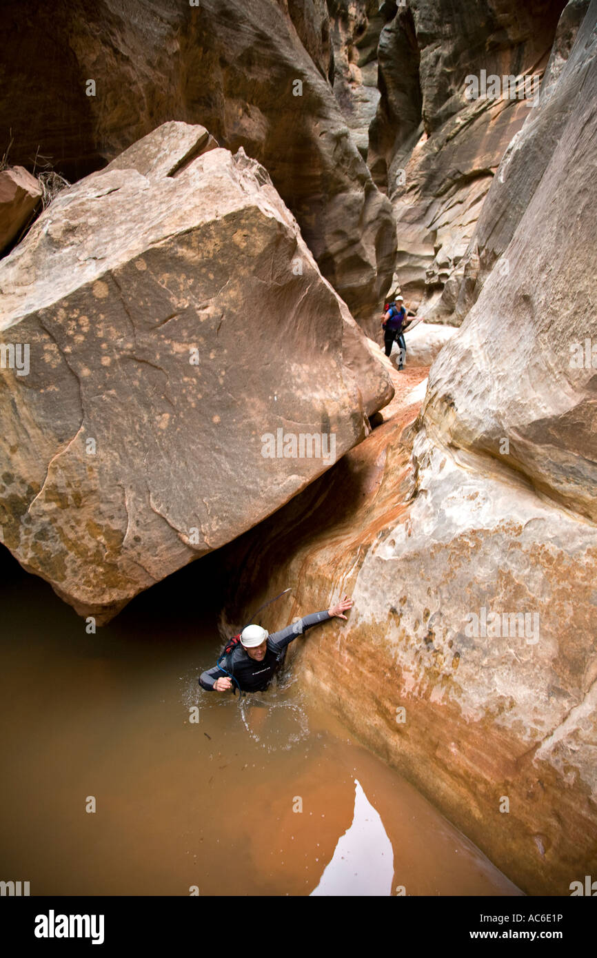 Mark Howe and Anne Bogan descending down Cheesebox Canyon, Utah, United ...